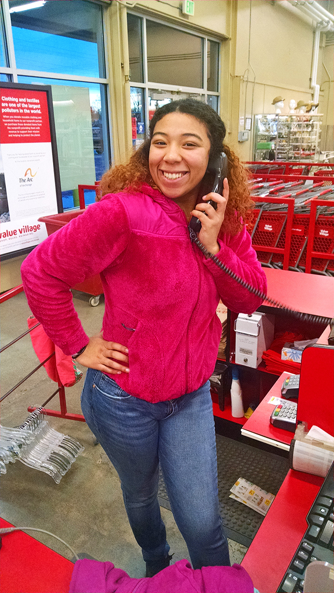 The checkout area showcases Value Village's signature red shopping bags&mdash;reusable treasures themselves for your next thrifting expedition.