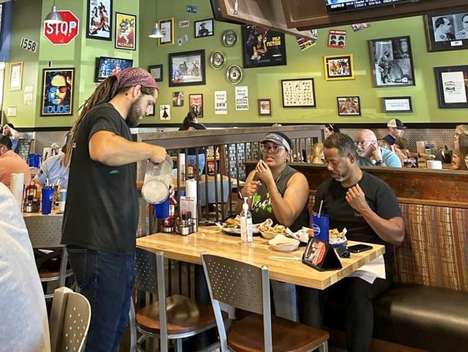 The magic moment when your server brings food that exceeds your expectations. Their expressions say it all&mdash;another burger mission accomplished.
