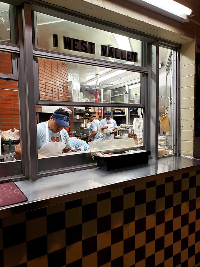 The kitchen window &ndash; where sandwich dreams materialize through skilled hands and decades of know-how.