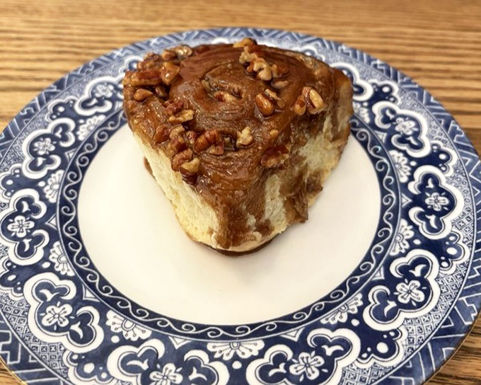 The sticky pecan roll—a spiral of breakfast decadence that makes you wonder why people bother with those sad desk granola bars.