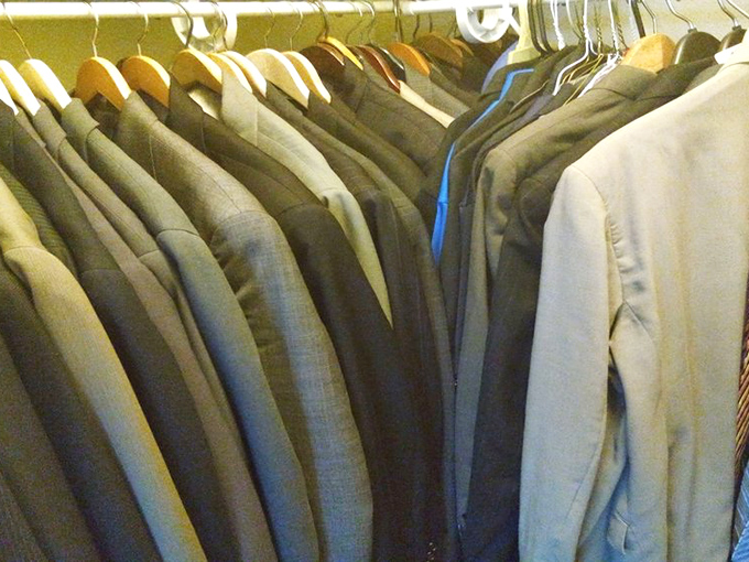 The suit selection that would make Don Draper jealous. Quality tailoring at thrift store prices—the ultimate power move.