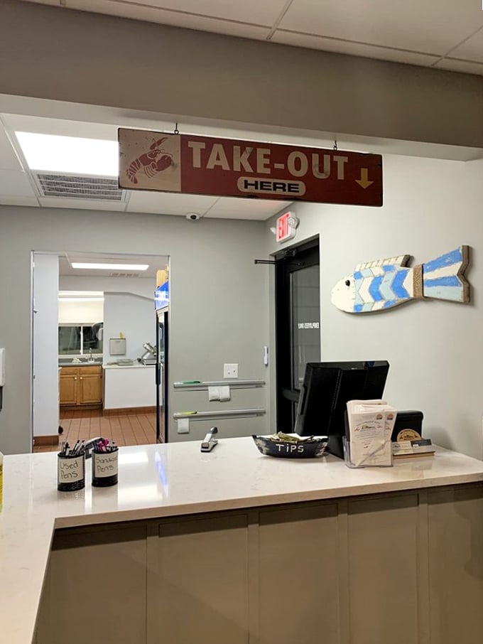 The take-out counter where seafood dreams come true for those on the go. That wooden fish on the wall has seen thousands of happy customers.
