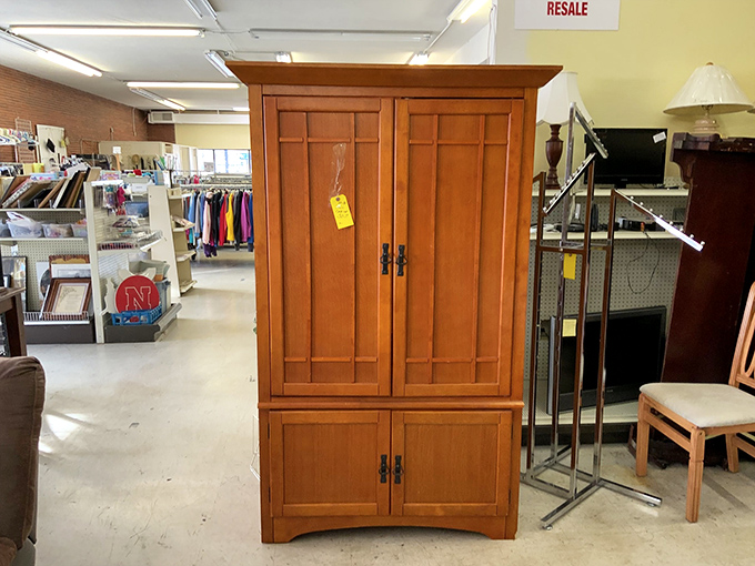 This stately wooden cabinet could hold your finest china or become the world's most dignified liquor cabinet. Craftsmanship that puts particle board to shame!