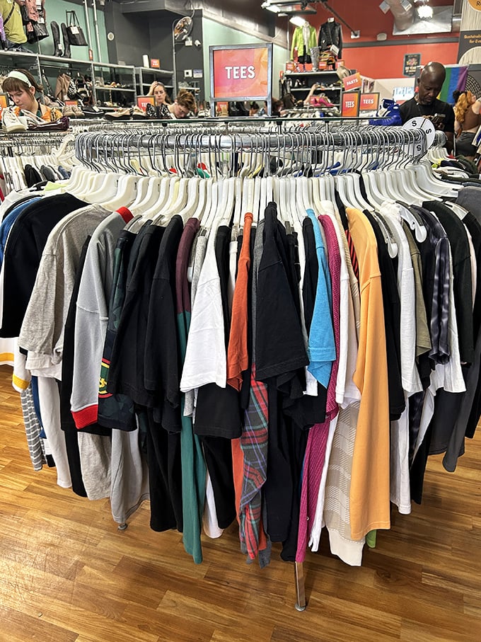 T-shirts organized by color create a rainbow of possibilities, from band logos to graphics that tell forgotten stories.