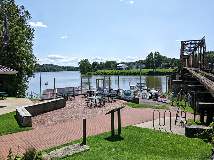 This riverside gathering spot offers the perfect vantage point for watching boats and contemplating life's current while dangling your feet over history.