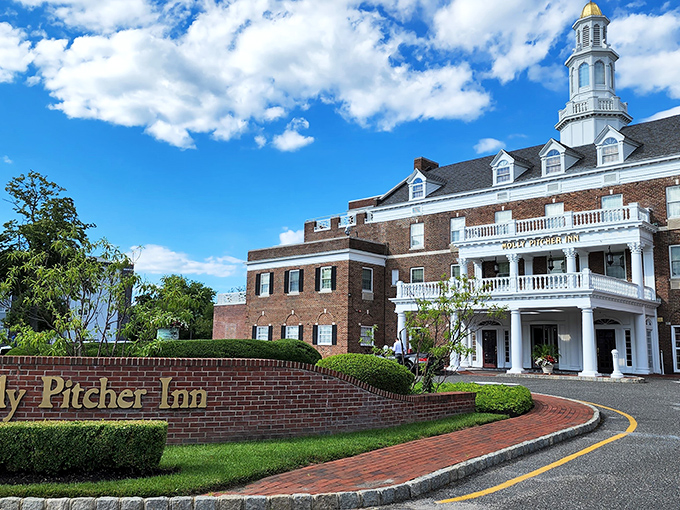 The Molly Pitcher Inn rises like a colonial grande dame overlooking the Navesink, offering hospitality with a side of history and river views.