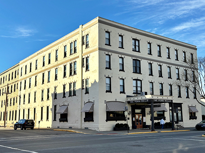The Penn Wells Hotel anchors downtown with quiet dignity, its cream-colored facade housing decades of stories, comfortable beds, and a lobby that invites lingering.