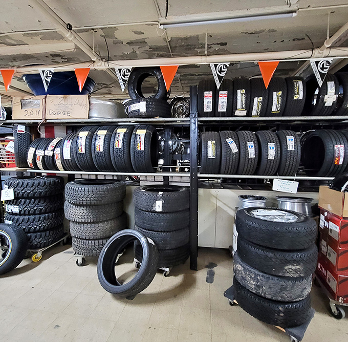 Tires stacked to the ceiling demonstrate that Super Flea truly sells everything, including things you drive on daily.