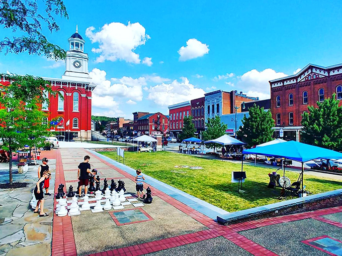 The town square's giant chess set invites players of all ages. Where strategic battles are fought with smiles instead of stress.
