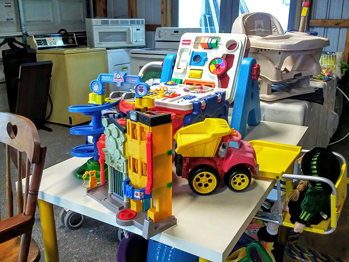 Toys pile high in colorful chaos, where Fisher-Price meets vintage treasures in delightful disorder.