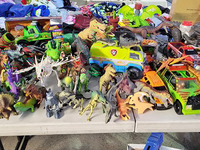 Toy dinosaurs and vehicles creating a miniature Jurassic parking lot that'll keep kids entertained for hours on end.