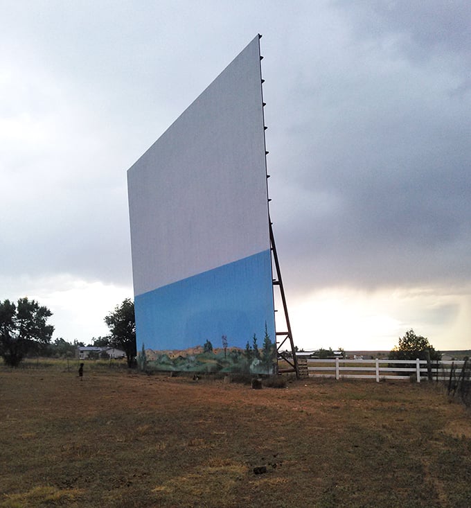 The massive screen, standing like a sentinel in the New Mexico prairie, has weathered decades of storms to keep the movie magic alive.