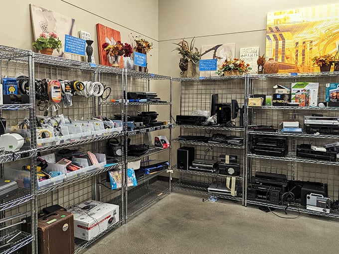 The electronics corner: where yesterday's gadgets await tech-savvy tinkerers or those seeking simpler digital times. Printers, stereos, and mysterious boxes of potential.