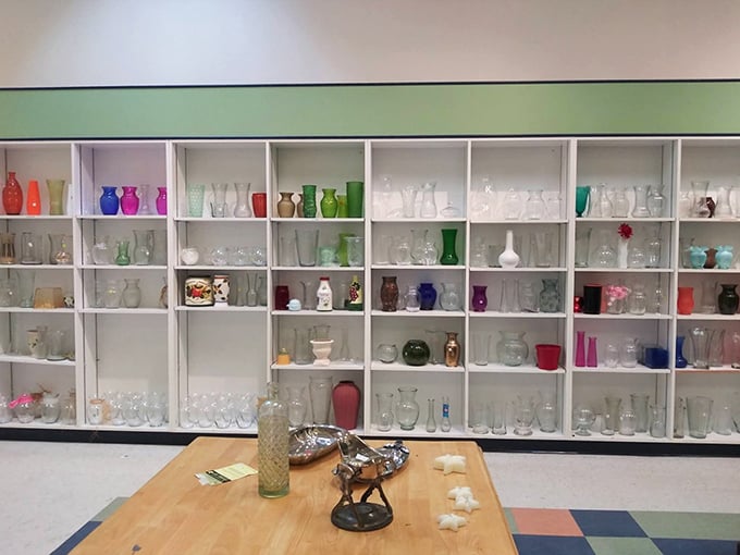 Vase heaven! This meticulously organized display showcases everything from delicate crystal to bold ceramics, ready for your flower arrangements.