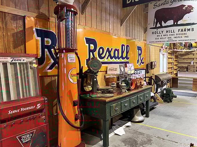 The vibrant orange Rexall gas pump stands tall against wooden walls adorned with vintage signs &ndash; a perfect snapshot of mid-century American road culture.