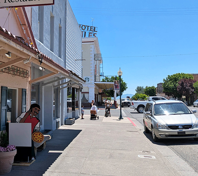 Downtown sidewalks where people still window-shop and greet neighbors instead of staring zombie-like at their phones.