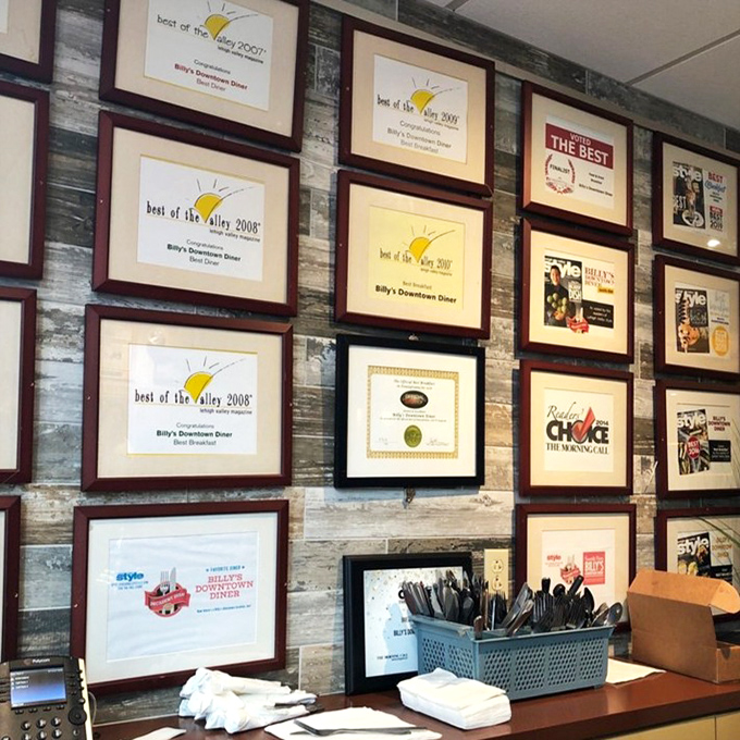 A wall covered in awards tells you everything about how the community feels about their neighborhood breakfast spot.
