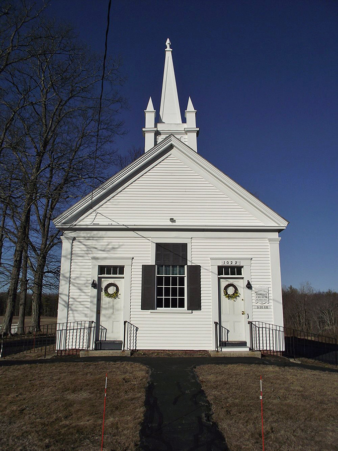 This white-steepled church could double as a Norman Rockwell painting, complete with wreaths that say "everyone's welcome here."
