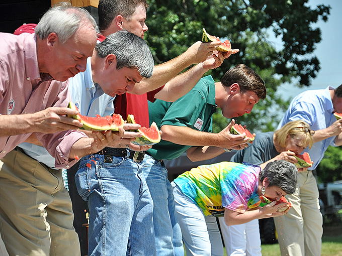 The watermelon eating contest brings serious competition and sticky faces, celebrating Hope's claim to fruit fame with genuine community enthusiasm and juice.