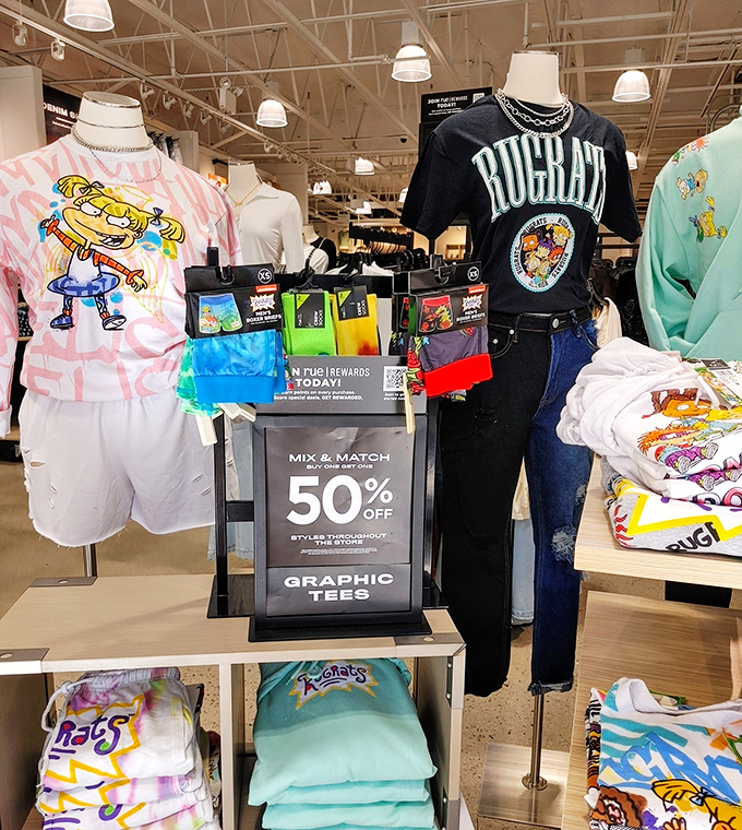 Graphic tees at 50% off &ndash; where nostalgic cartoon characters meet your adult budget in a perfect retail harmony.