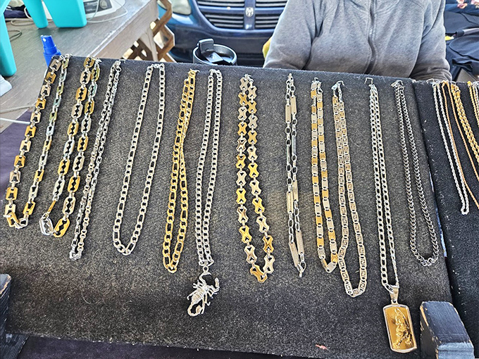 Gold and silver treasures laid out like a modern pirate's bounty. These chains and pendants prove that bling doesn't require breaking the bank.