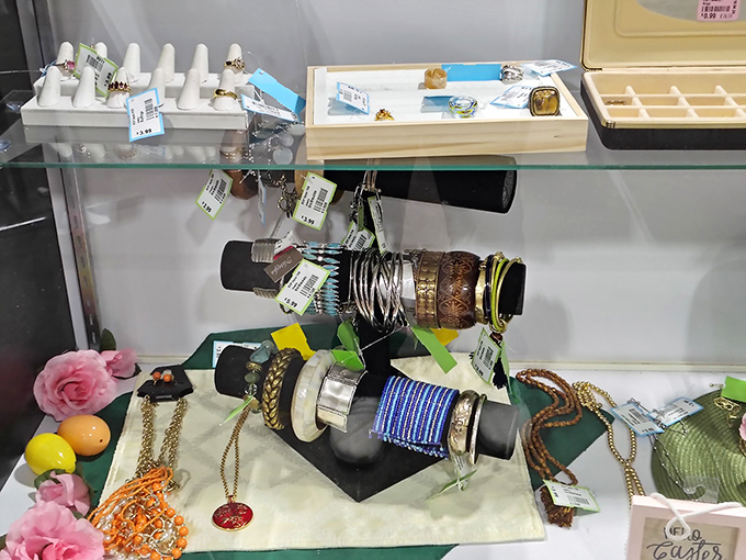 Jewelry and accessories displayed with care&mdash;someone's former statement pieces waiting for their second act on your wrist or neck.