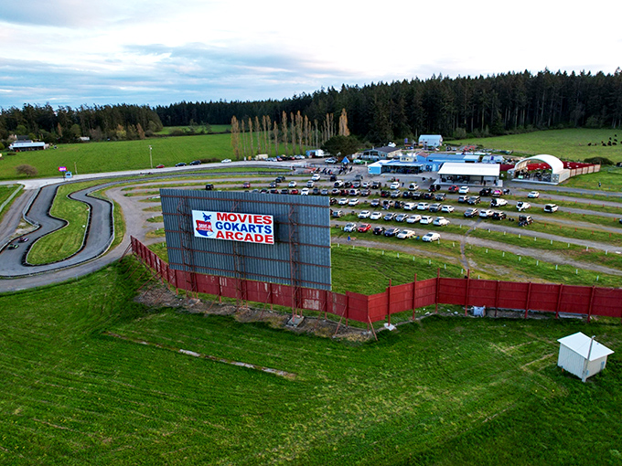 From above, the Blue Fox reveals its full glory: go-kart track, packed lot, and that magnificent screen.