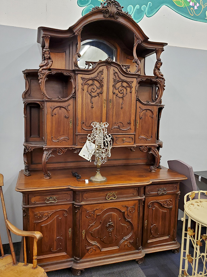 An ornate cabinet that practically demands to be filled with your grandmother's fine china and whispered family secrets.