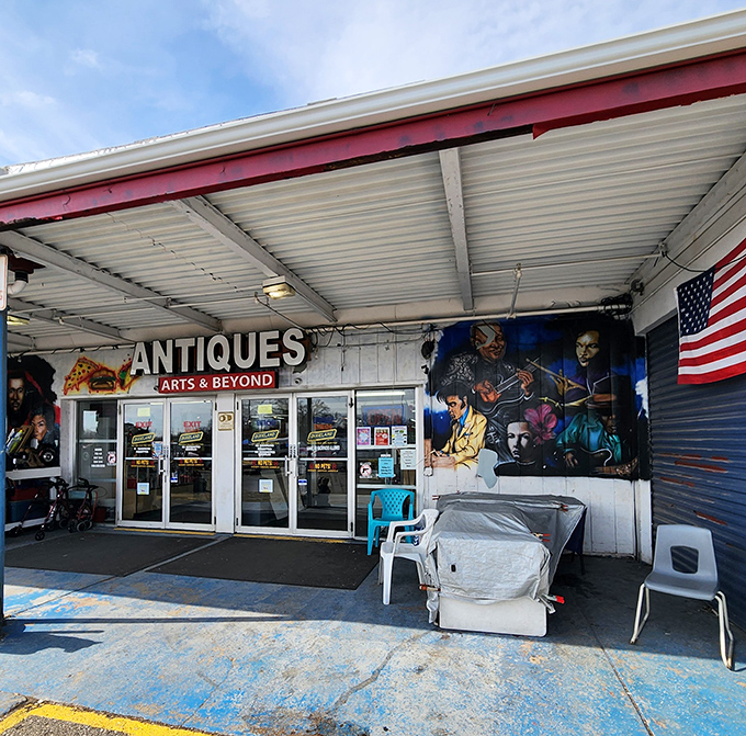 The "Antiques, Arts & Beyond" entrance promises exactly what it delivers&mdash;a rabbit hole of curiosities with Hendrix watching over it all.