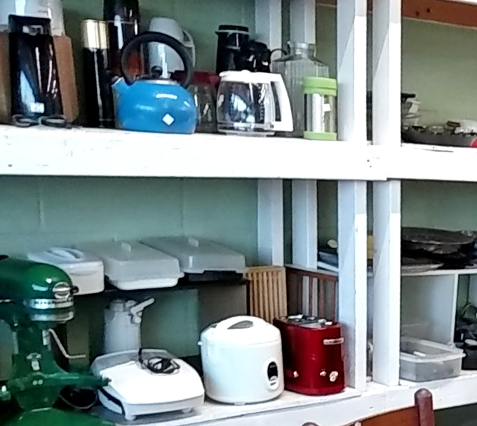 Kitchen appliances lined up like contestants on a cooking show &ndash; that green KitchenAid mixer might just inspire your next baking adventure.