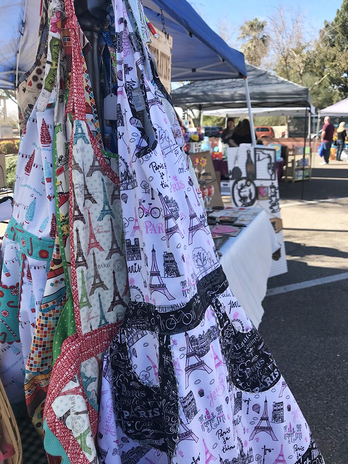 Parisian-themed aprons hanging like flags of a delicious nation where calories don't count and everyone's grandmother taught them to cook. Oui, s'il vous plaît!