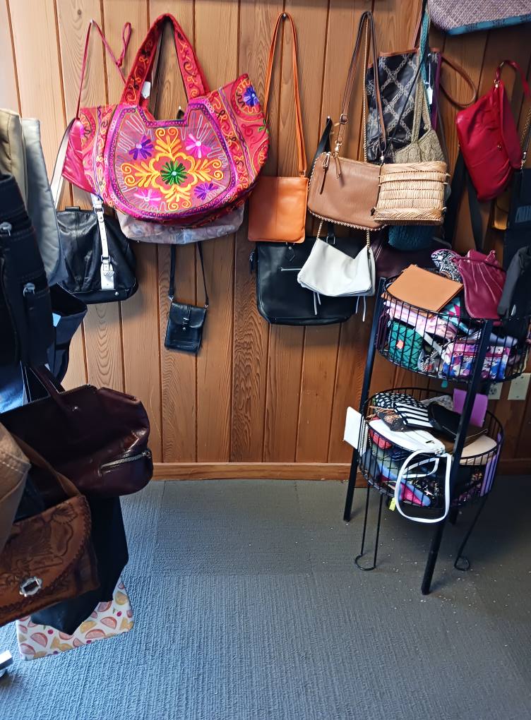 Handbag heaven! That vibrant pink embroidered tote would make even the most serious fashionista break into spontaneous jazz hands.