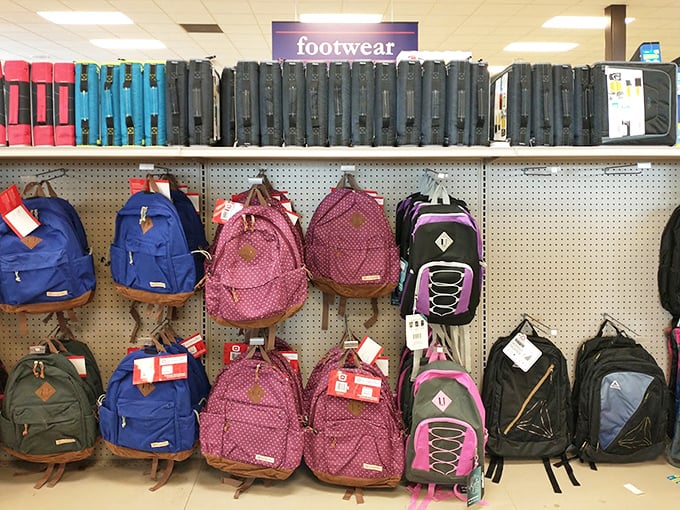 Backpacks hang ready for students, hikers, or anyone who needs to carry stuff without spending next month's rent.