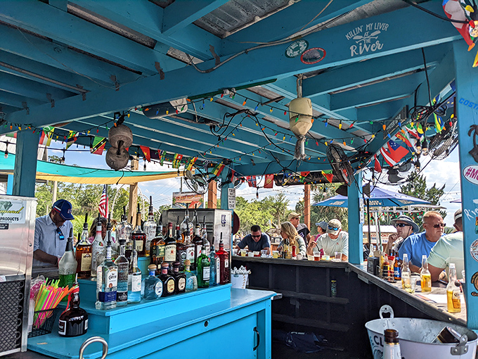 The outdoor bar's turquoise charm and impressive spirits collection prove that boat drinks taste better when you can actually see boats while drinking them.