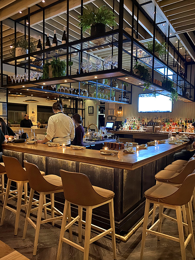 The bar isn't just where drinks are made&mdash;it's theater in the round, with bottles and glasses suspended like modern art above skilled bartenders.