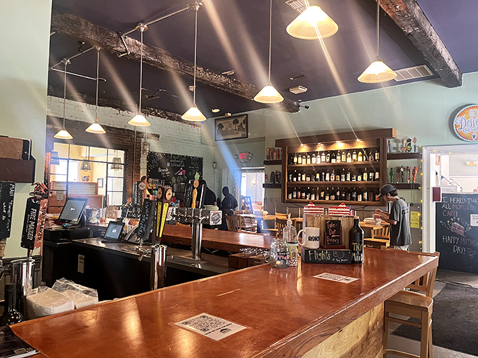 The bar area gleams with promise, bottles standing at attention like soldiers guarding liquid happiness.
