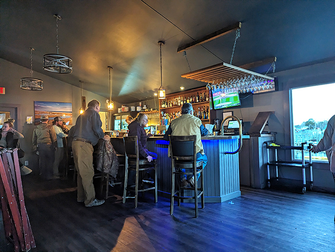 The kind of bar where strangers become friends over local oysters and fishing tales. Notice nobody's looking at their phones? That's the Island House magic.
