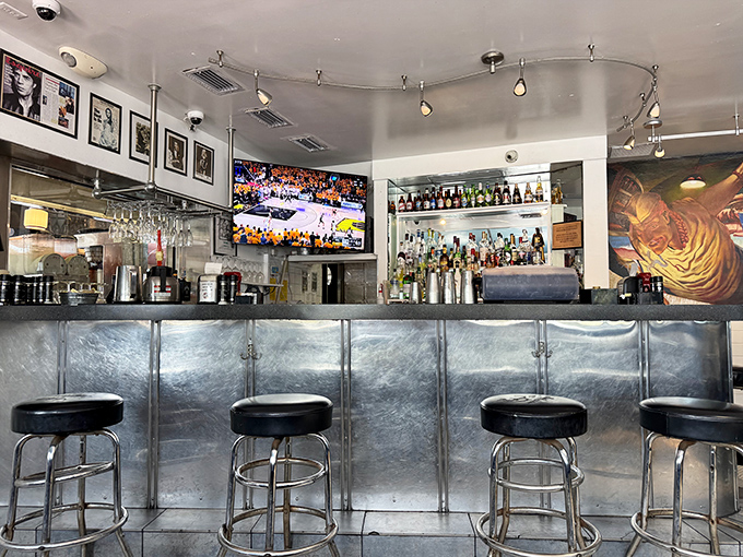 The bar area gleams with chrome and possibility, stocked with enough options to make any meal feel celebratory.