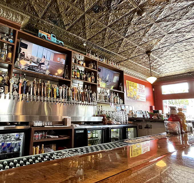 The bar gleams under ornate tin ceiling tiles, beer taps standing at attention like soldiers ready to serve the thirsty Milwaukee masses.