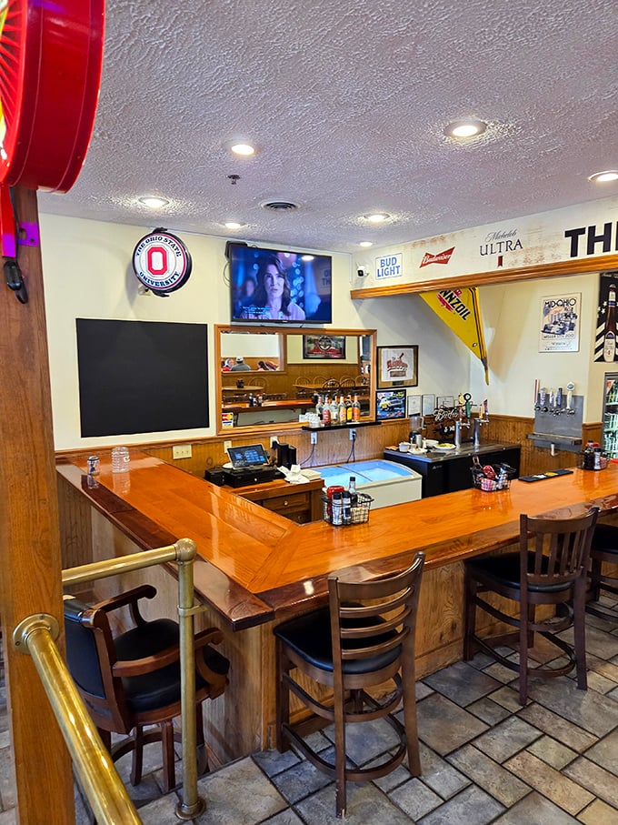 A bar that understands its mission: cold drinks, good company, and enough sports memorabilia to start conversations but not arguments.