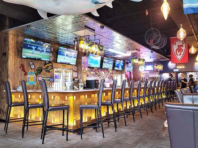 The bar glows like a sunset over water, promising libations worthy of Neptune himself.