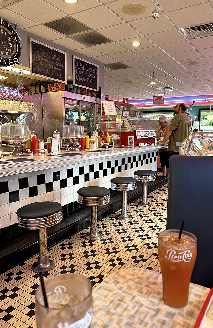 The counter where magic happens. Those classic stools have witnessed countless coffee refills and life-changing breakfast decisions.