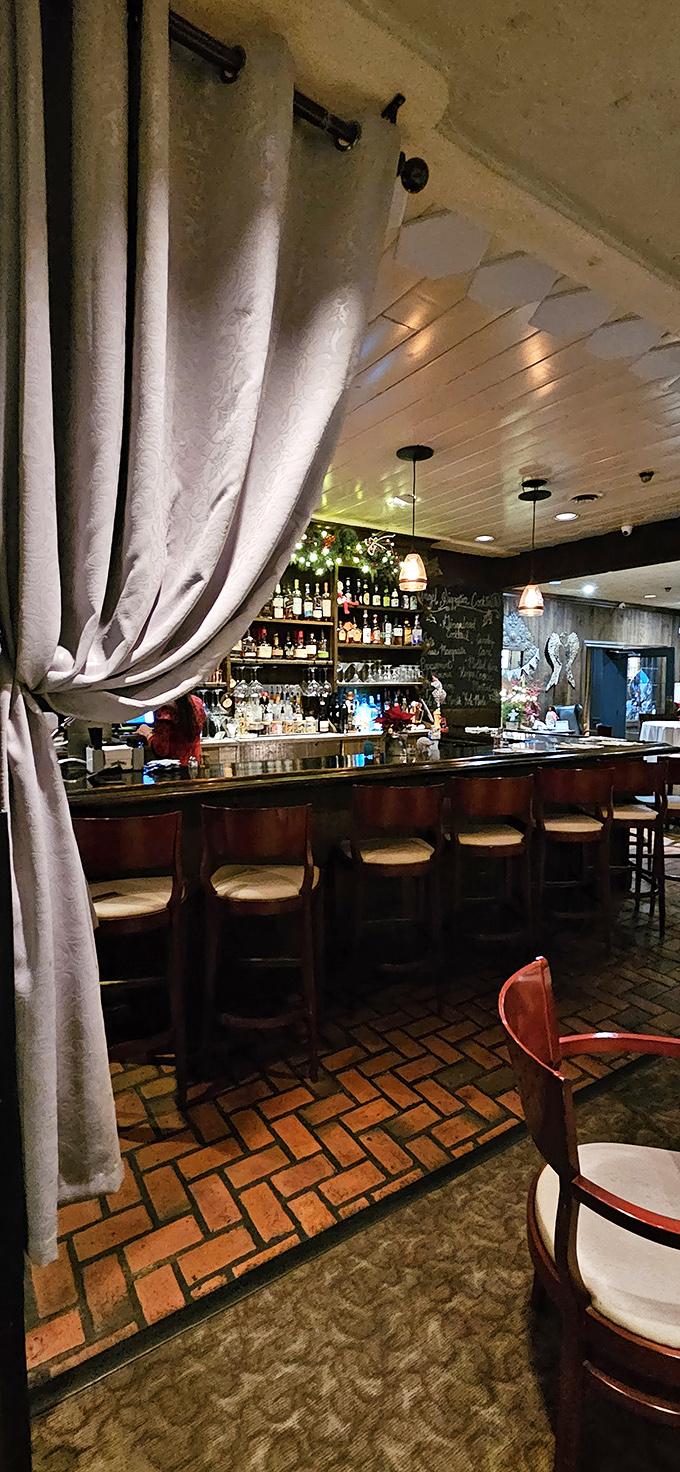 The bar area beckons with bottles of liquid possibilities, all waiting to complement whatever culinary adventure you choose.