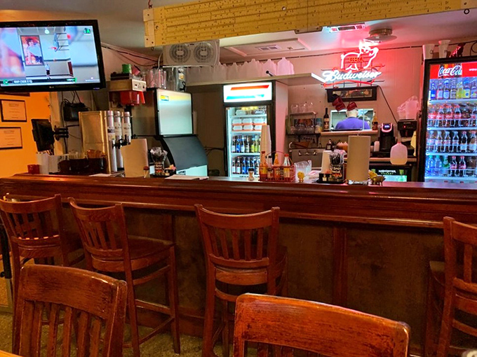 The bar's warm wood tones and no-nonsense setup tell you everything: this place prioritizes substance over style, just like its barbecue.