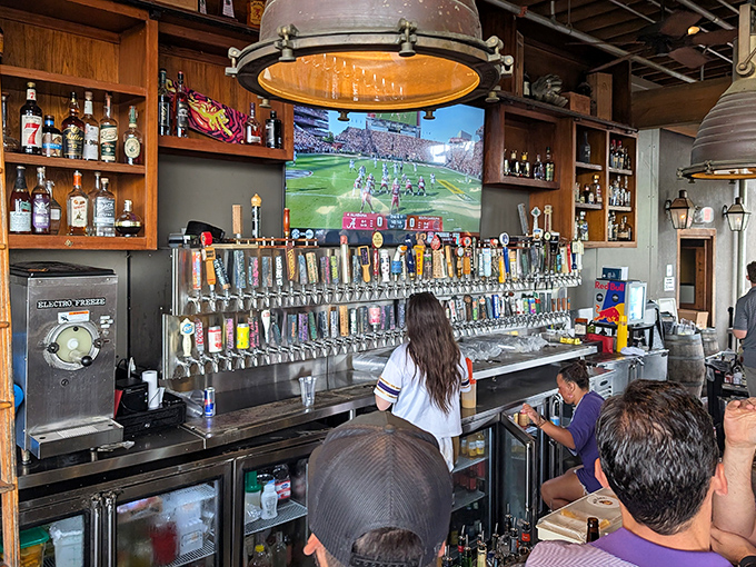 The bar's impressive tap selection stretches like a liquid rainbow, promising flavor adventures from around the world while LSU plays on the big screen.