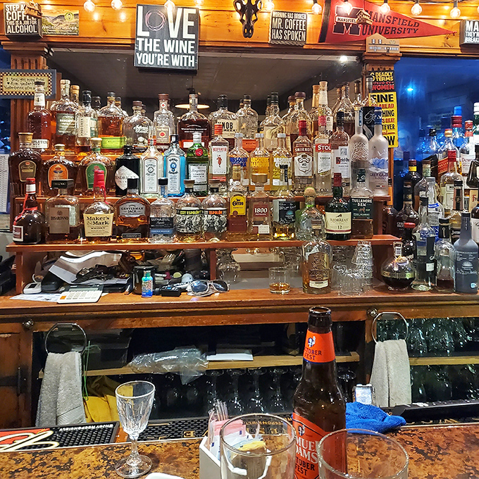 The bar doesn't just stock liquor; it curates liquid happiness with a sign that wisely advises to "Love the wine you're with."