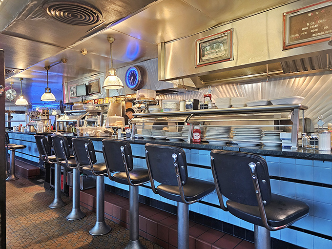 The beating heart of diner operations&mdash;where coffee mugs are filled, orders are called, and breakfast symphonies are conducted with spatula batons.