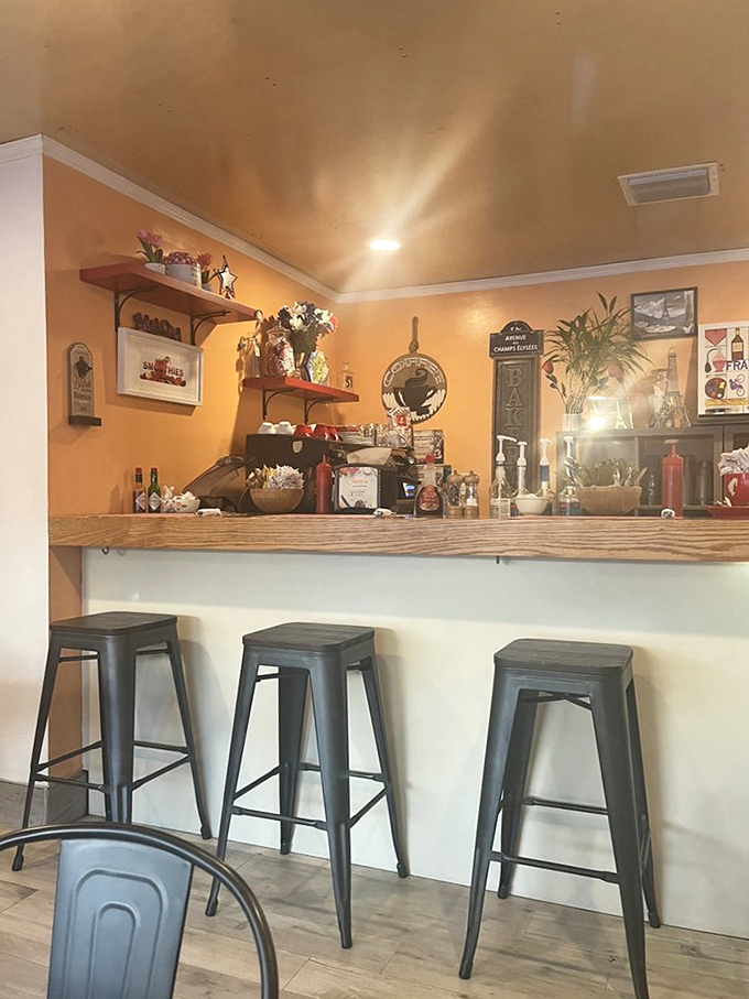 The bar area feels like the cozy corner of a French countryside kitchen, where every shelf tells a story of culinary passion.