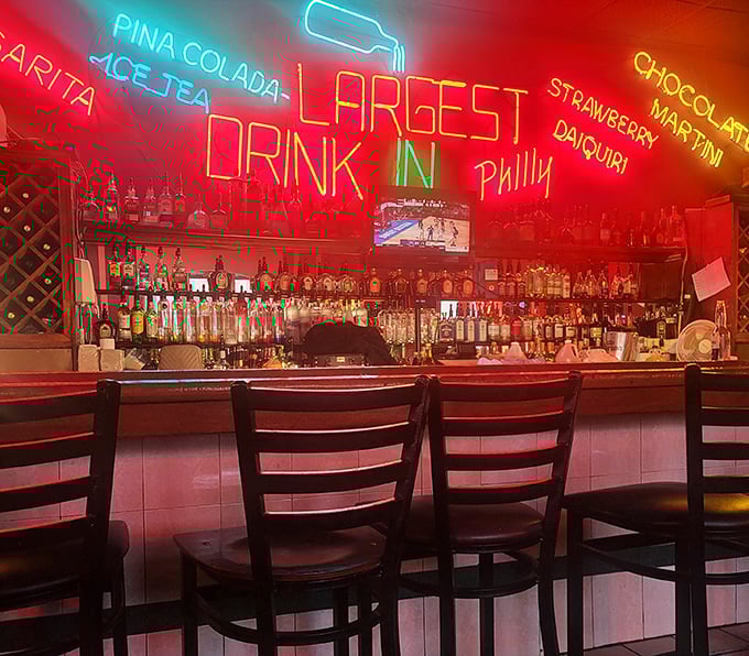 The bar area glows with neon promise&mdash;"LARGEST DRINK IN PHILLY" might be the only thing that could possibly upstage the sandwiches.