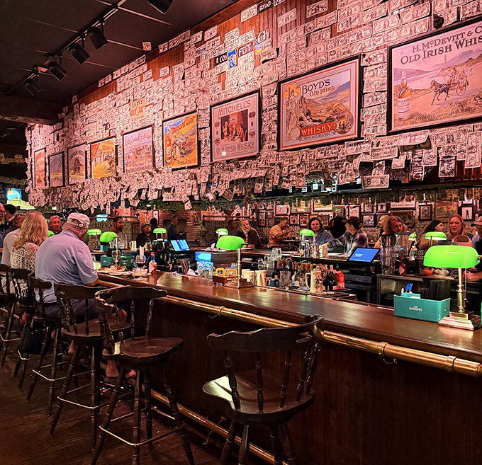 The bar area&mdash;where Irish whiskey bottles stand at attention and bartenders orchestrate liquid happiness beneath a mosaic of customer-donated currency.